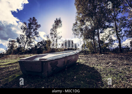 Old boat on dry land Stock Photo - Alamy