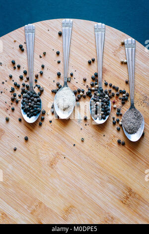 Overhead view of cutting board by various vegetables and spices on ...