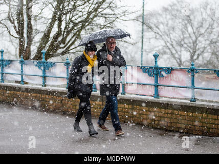 People walk during a snowfall in Istanbul, Turkey, Monday, Jan. 19 ...
