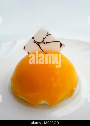Mousse with mango in the plate Stock Photo - Alamy