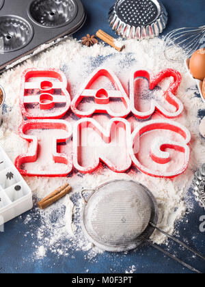 Flour letters spelling Baking with tools and sweet food ingredients ...