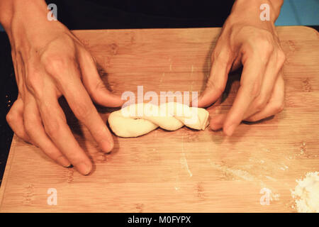 man kneading raw donut dough Stock Photo - Alamy