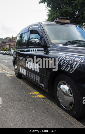 Black Taxi Tour parked in front of St Peters Church in Woolton Village ...