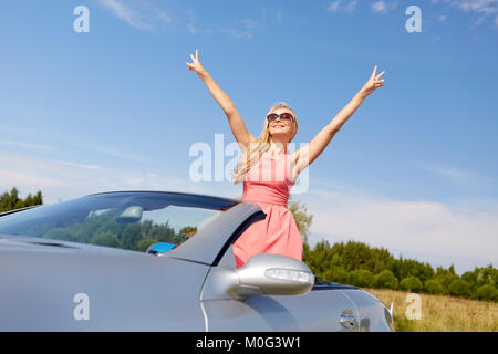Cheerful woman winning the car Stock Photo - Alamy