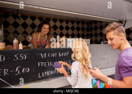 happy customers queue at food truck Stock Photo - Alamy