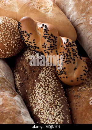 Mixed breads and grains background, close up Stock Photo - Alamy