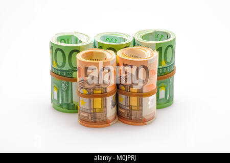 Banknotes of 50 euro in rolls, tied with pink gift ribbon on a white ...