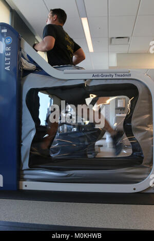 A patient at the Intrepid Spirit on Fort Bragg, N.C., runs on the Alter ...