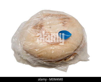 A stottie, or stotty, cake (or oven bottom cake) isolated on a white ...