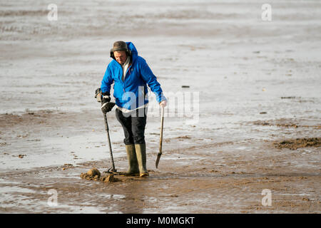 Metal detectorists scour the beach at Southport, UK looking for ...