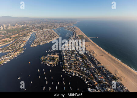 AERIAL VIEW. Balboa Peninsula in the foreground with Balboa Island ...