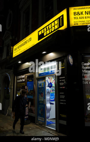 Western Union Money Transfer and paypoint signage and logo at night ...