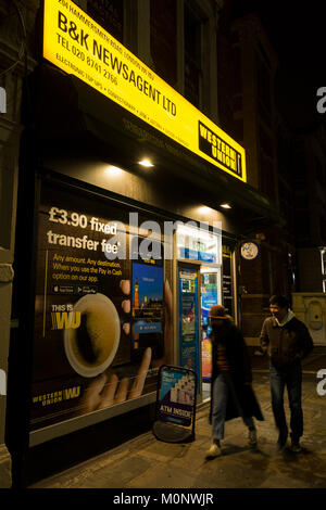 Western Union Money Transfer and paypoint signage and logo at night ...