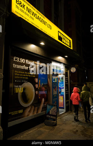 Western Union Money Transfer and paypoint signage and logo at night ...