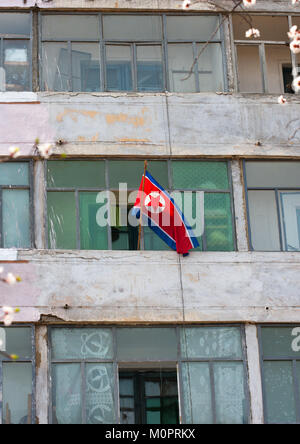 North Korean flag at a decrepit apartment balcony, Pyongan Province ...
