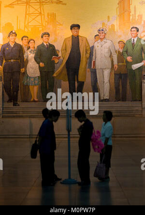 People read a Rodong Sinmun newspaper article in Pyongyang on June 17 ...