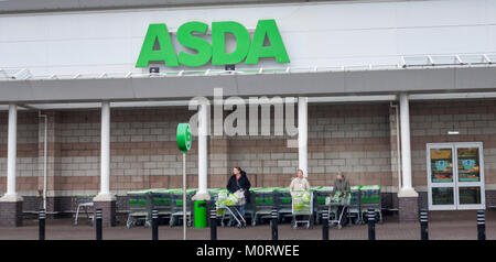 people waiting for taxis outside an asda store in penryn, cornwall, uk ...