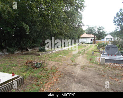This image depicts a cemetery in Vecses, Hungary. The cemetery serves ...