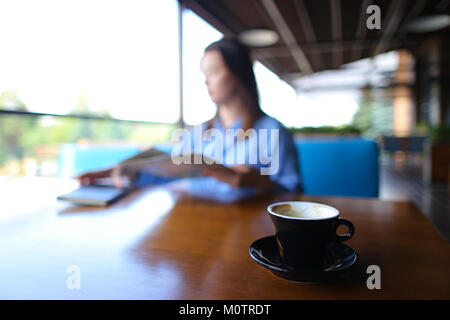 Beautiful lady reading menu at cafe Stock Photo - Alamy
