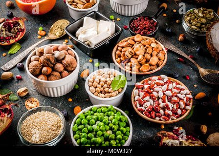 Table with food, selection of superfoods, cereals, fruits, berries ...