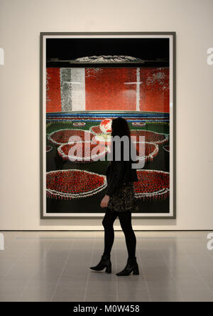 A visitor to a gallery walks past a work by South Korean artist Lee ...