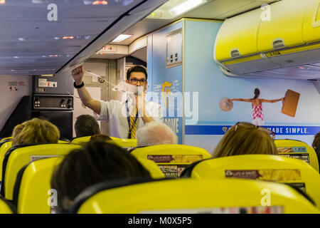 Flight safety demonstration aboard a Ryanair flight. Attendant Stock ...