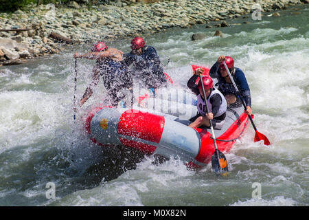 A group of men and women are rafting on the river, extreme and fun ...
