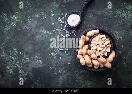 Raw peeled peanuts on bowl. Top view Stock Photo - Alamy