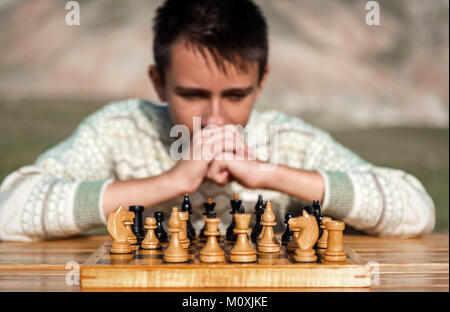 Teenager playing chess Stock Photo - Alamy