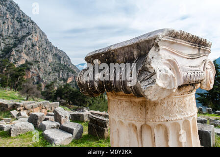 Fragment of column in the excavation sight of ancient town of Delphi ...