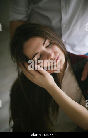 Touching face, millennial brunette woman touching face. Facial skin ...