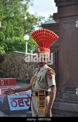 Raising the Flag at the Wagah Border Flag Ceremony Stock Photo - Alamy