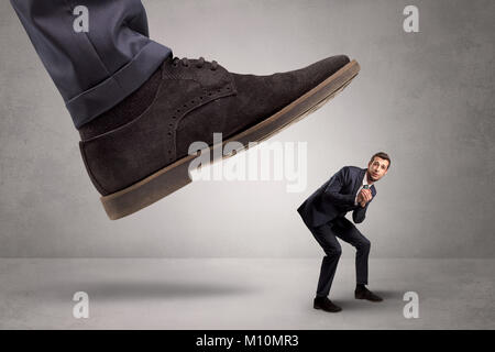 Young businessman illustrated inconsiderable by being trampled Stock ...