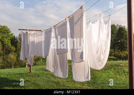 fresh clean white sheet drying on washing line in outdoor Stock Photo ...