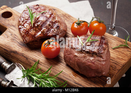 Grilled fillet steaks on cutting board Stock Photo - Alamy