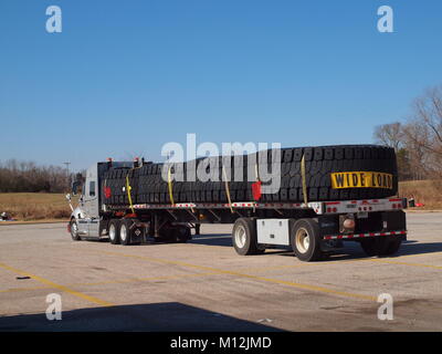 * HEAVY LOAD A truck carrying a massive load of heavy goods nearly ...