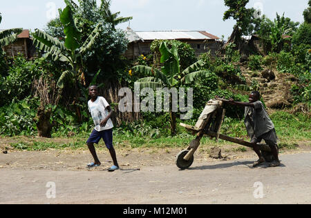 A Congolese boy with his chukudu - a traditional wooden bike Stock ...