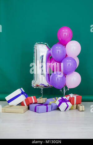 balloons of different colors with gifts for the holiday Stock Photo - Alamy