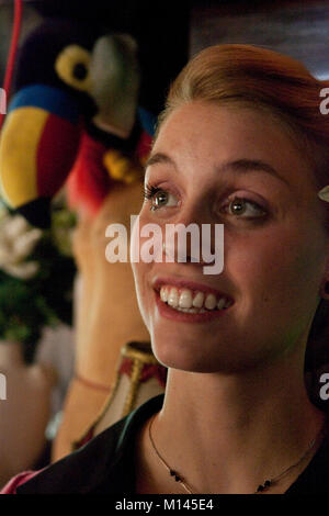 Portrait of a blonde girl with blue eyes without makeup on a light ...