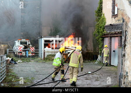 Fire Brigade attending a skip fire in North Wales Stock Photo - Alamy