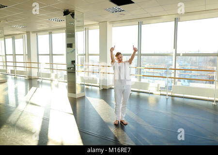 Blonde guy spotting at studio Stock Photo - Alamy