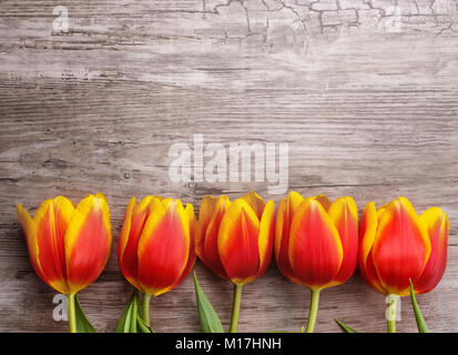 Beautiful yellow tulips on wooden background. Spring time Stock Photo ...