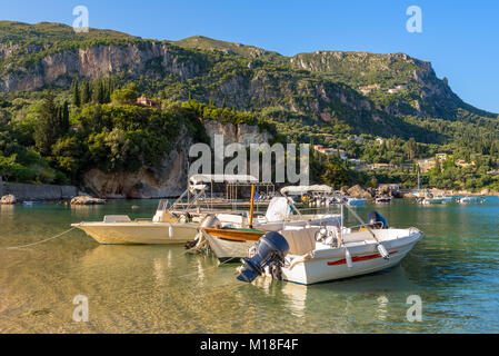 Alipa beach in Paleokastritsa bay with sand and crystal sea water ...