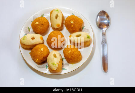 Indian sweet , sandesh bengali mithai garnish with pistachio and ...