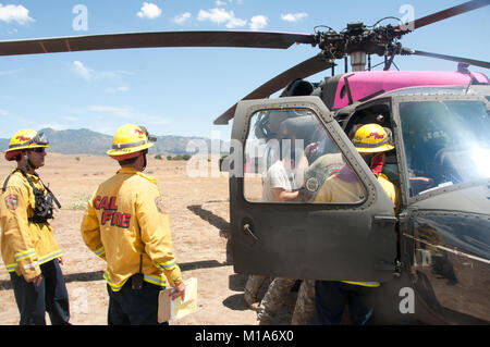 A California National Guard UH-60 Black Hawk helicopter prepares to ...