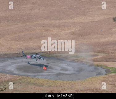 Cal Fire officer Brad Loven briefs Marine Light Attack Helicopter ...