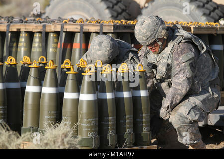 Illuminating projectiles, each weighing close to 100 pounds, are staged ...