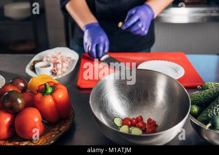 Man cutting ingredients in kitchen Stock Photo - Alamy