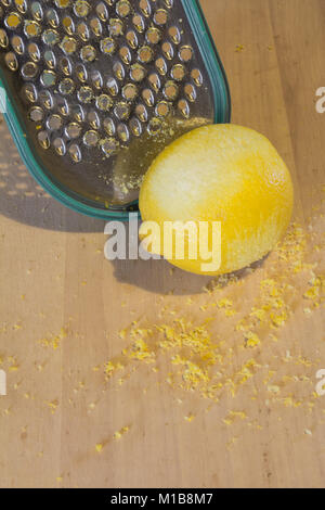 Grating a lemon Stock Photo - Alamy