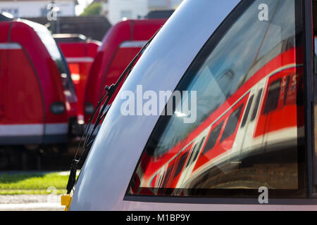 a modern passenger train reflection close up Stock Photo - Alamy